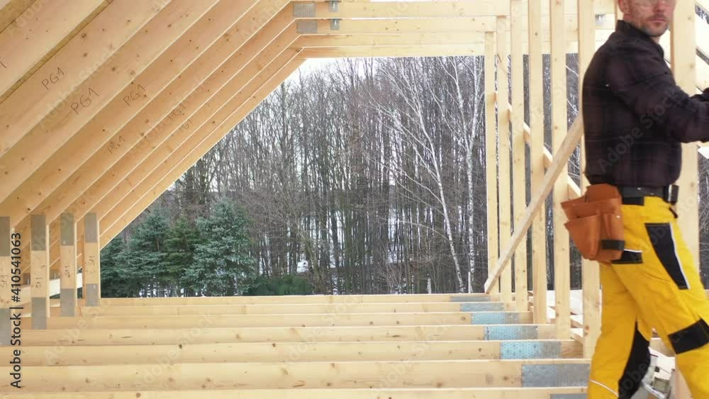 Construction Worker and the Wooden Skeleton Frame Structure of Newly ...