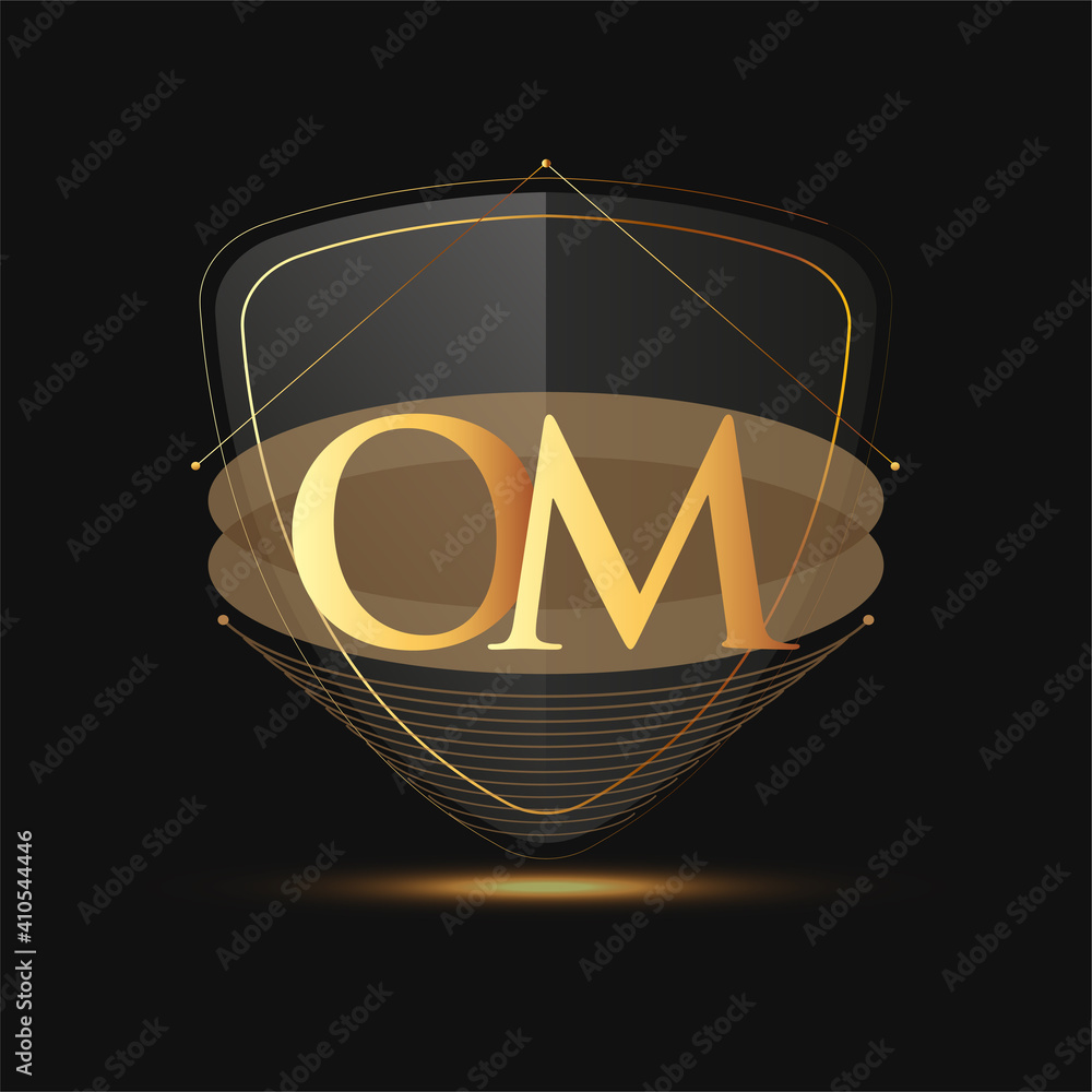 Initial logo letter OM with shield Icon golden color isolated on dark ...