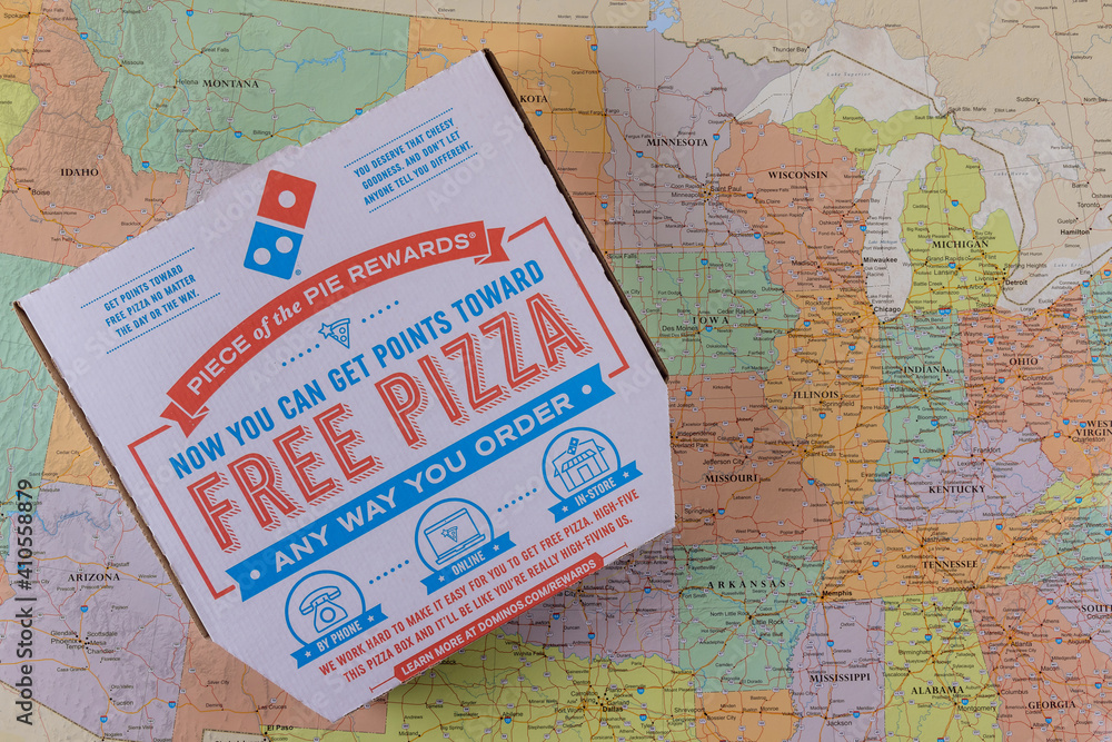 Take out boxes on a American pizza with Dominos Pizza logo with North ...