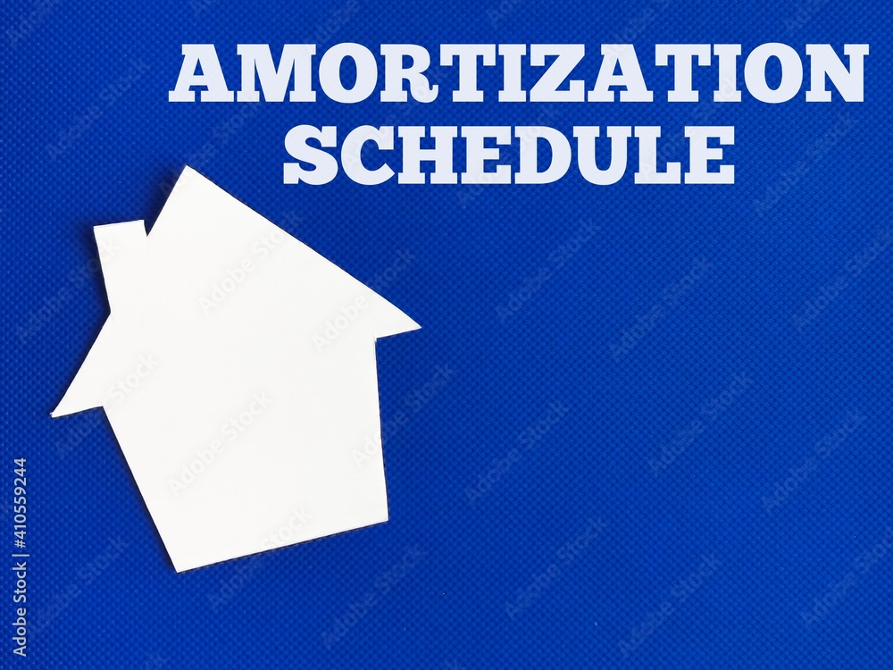 Top view text AMORTIZATION SCHEDULE on blue background with white ...