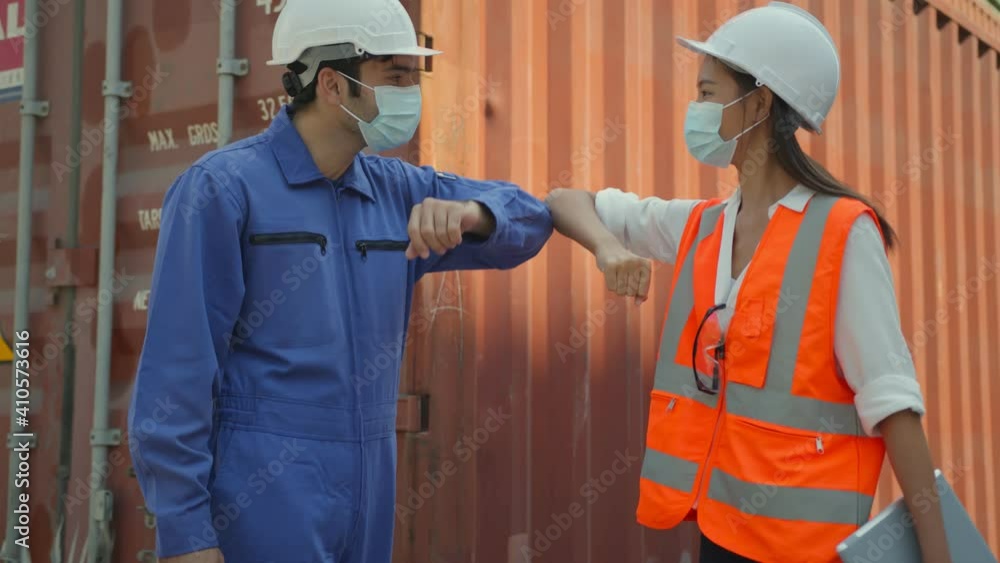 Elbow bump. New normal greeting to avoid the spread of coronavirus. Two ...