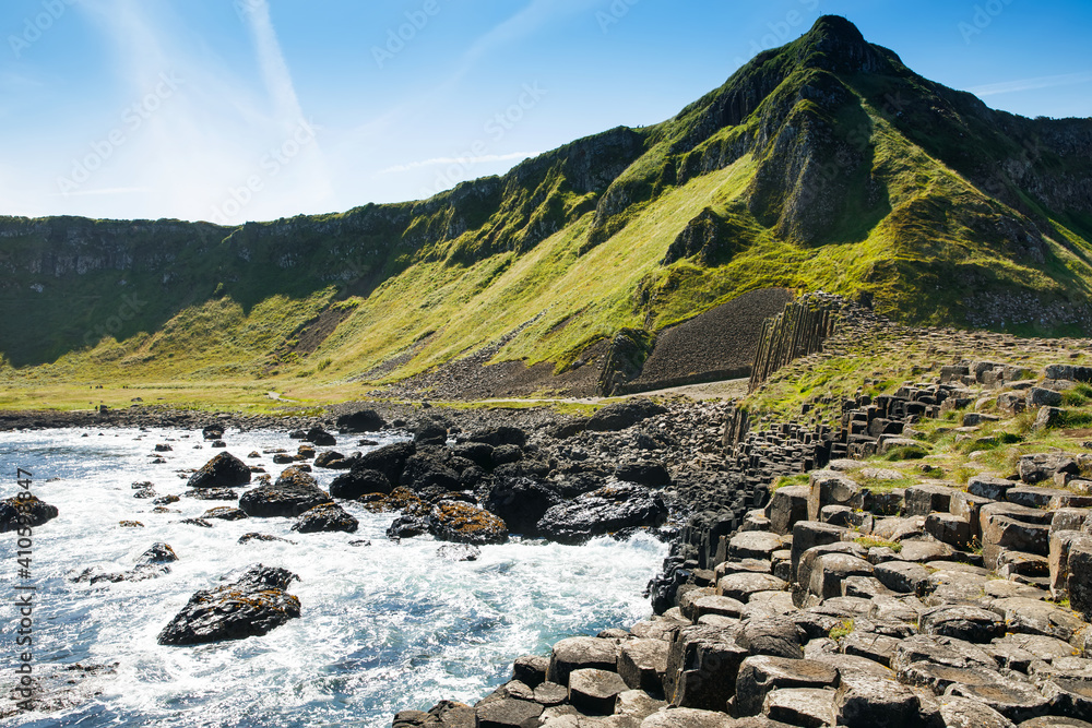 Landscape of Giant's Causeway trail with a blue sky in summer in ...