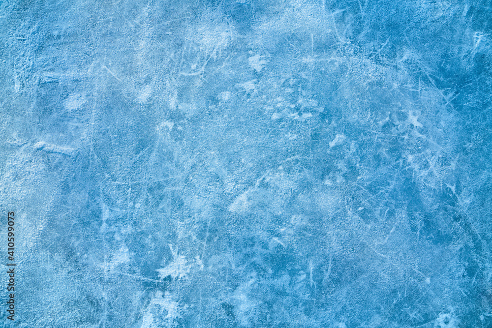 Ice blue background with ice skating tracks. Covered with a thin layer ...
