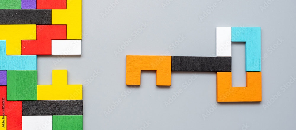 Key and keyhole shape of geometric colorful wood puzzle pieces. logical ...