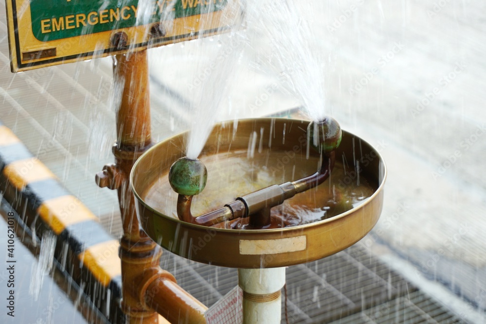 Activating eye wash station for emergency use at construction site in a ...