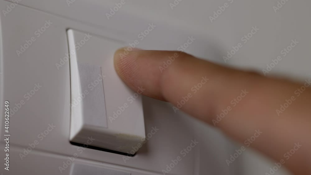 Earth Hour, Close up male hand turn off the light to saving electrical ...