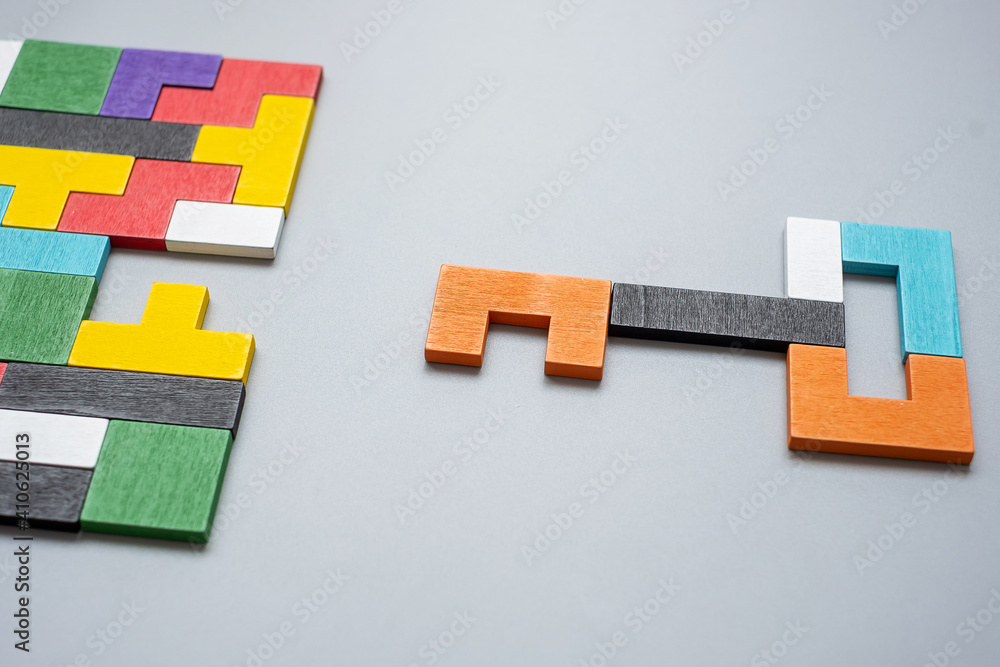 Key and keyhole shape of geometric colorful wood puzzle pieces. logical ...