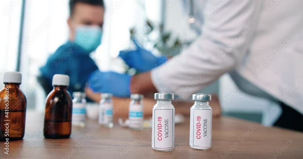 Close up shot of vaccine tubes with liquid, ampoules with vaccine from ...