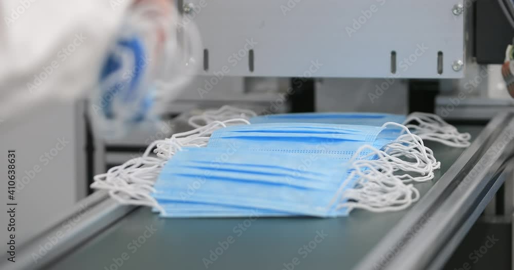 Covid protection. Manufacture of surgery masks. Medical mask on ...