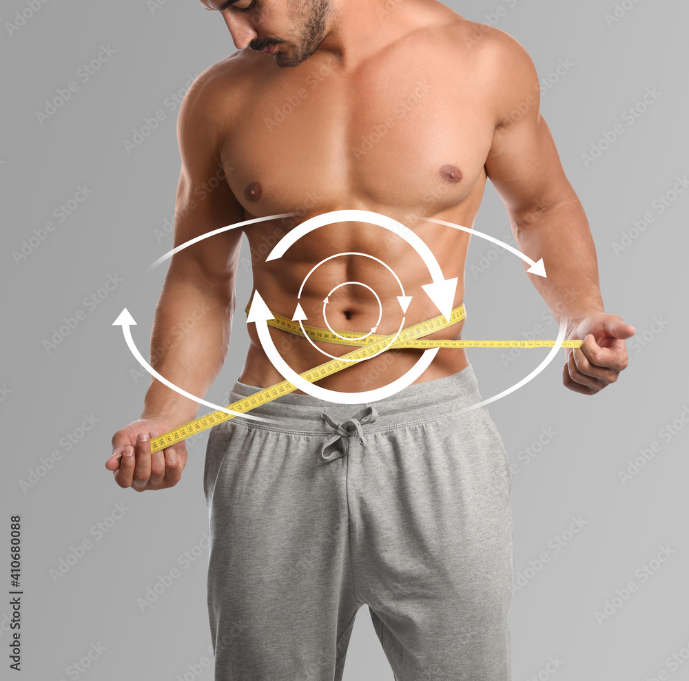 Metabolism concept. Man with perfect body on light grey background ...