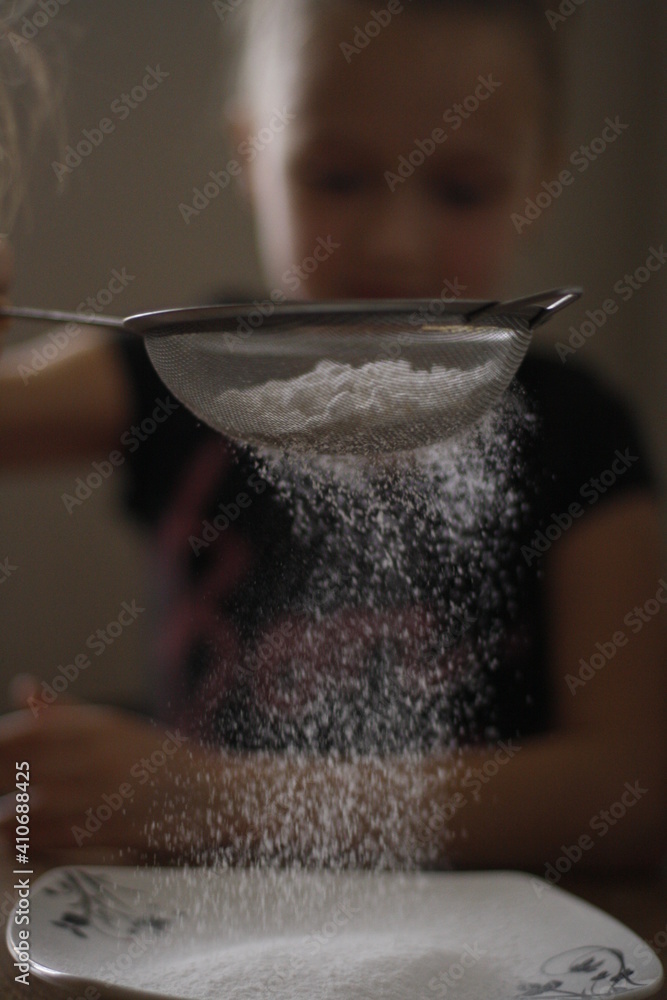 sifting flour through a sieve falling flour Stock Photo | Adobe Stock