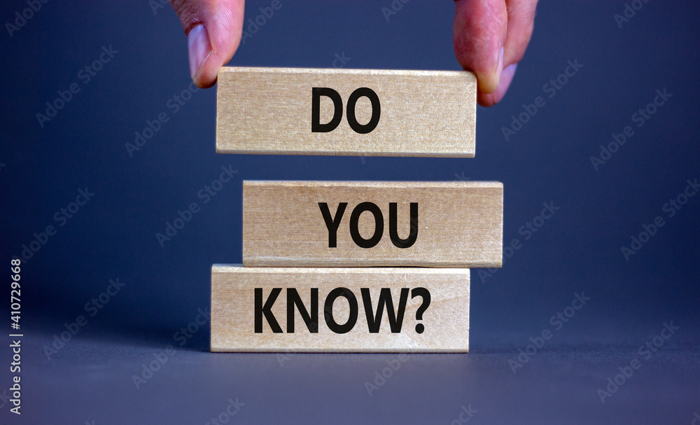 Do you know symbol. Businessman hand. Wooden blocks with words 'do you ...