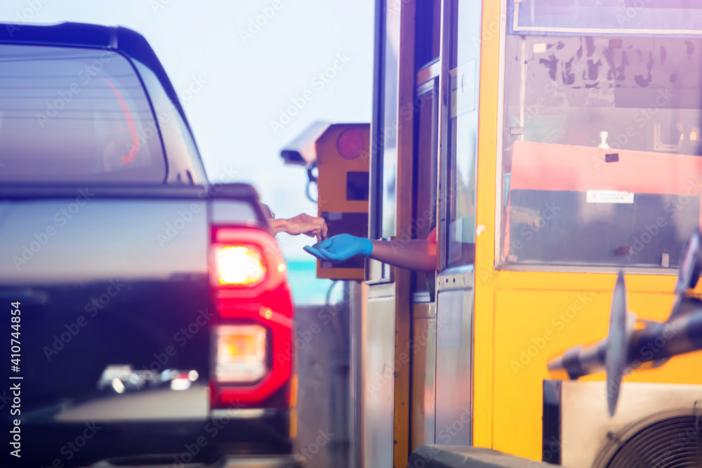 Motion blur image of Driver pay for the expressway. Woman pays money to ...