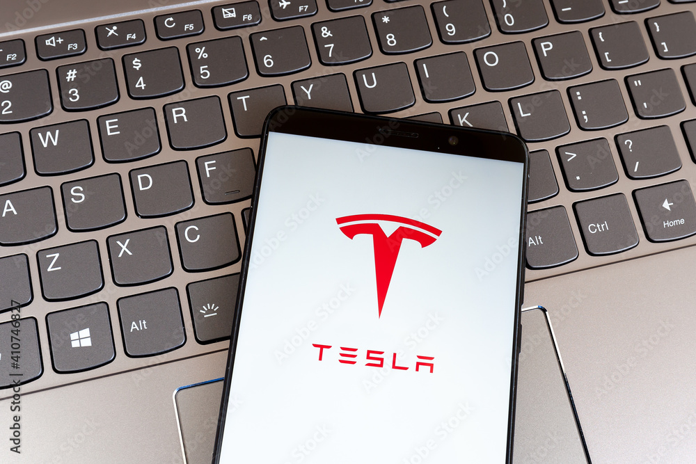 Toronto, Canada - February 1, 2021: Tesla logo on smartphone screen on ...