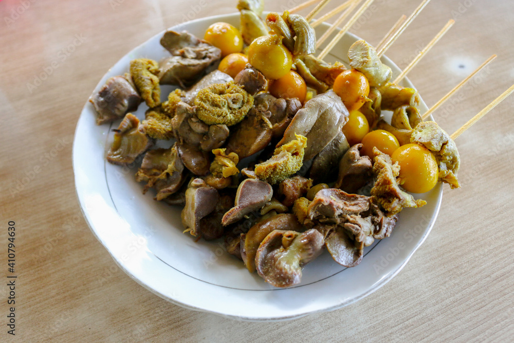 Sate jerohan or innards egg satay. Indonesian traditional food made ...
