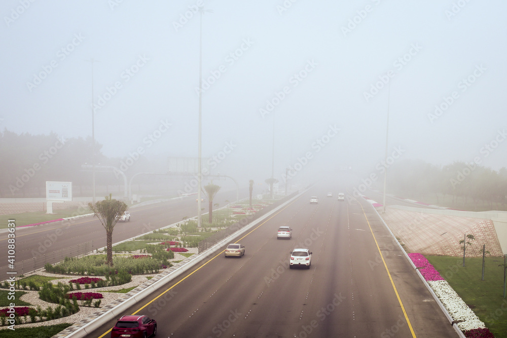 Road in the fog, sign mention keep distance for motorists at dubai road ...
