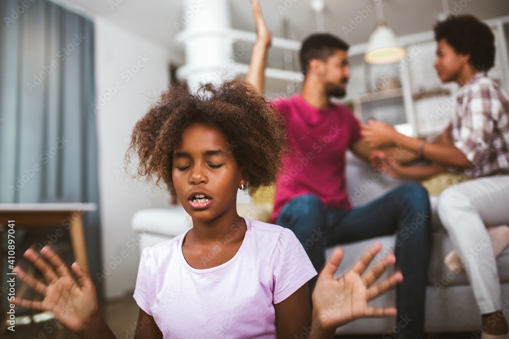 Sad, desperate african american girl during parents quarrel,angry ...