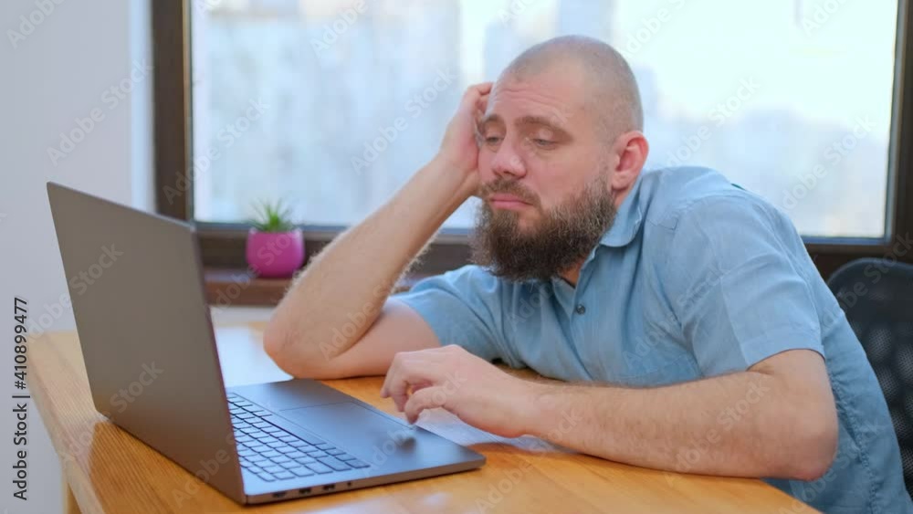 Tired elder man employee sitting at working place at home office. Close ...