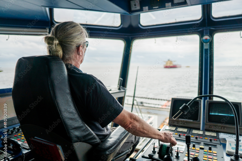 Captain of deck Officer on bridge of vessel or ship during navigaton ...
