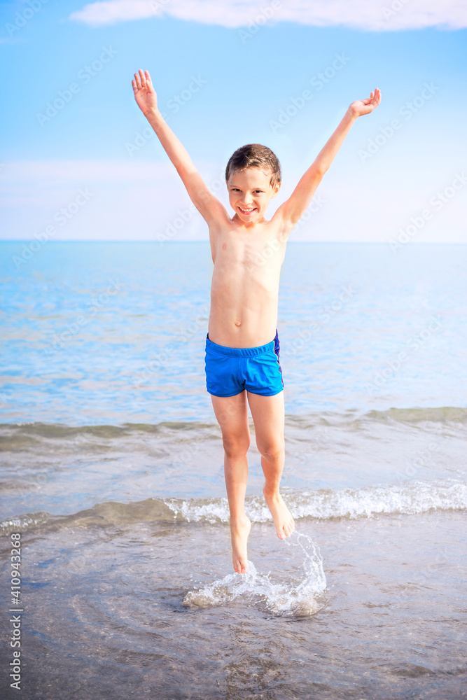 smiling boy on the beach Stock Photo | Adobe Stock