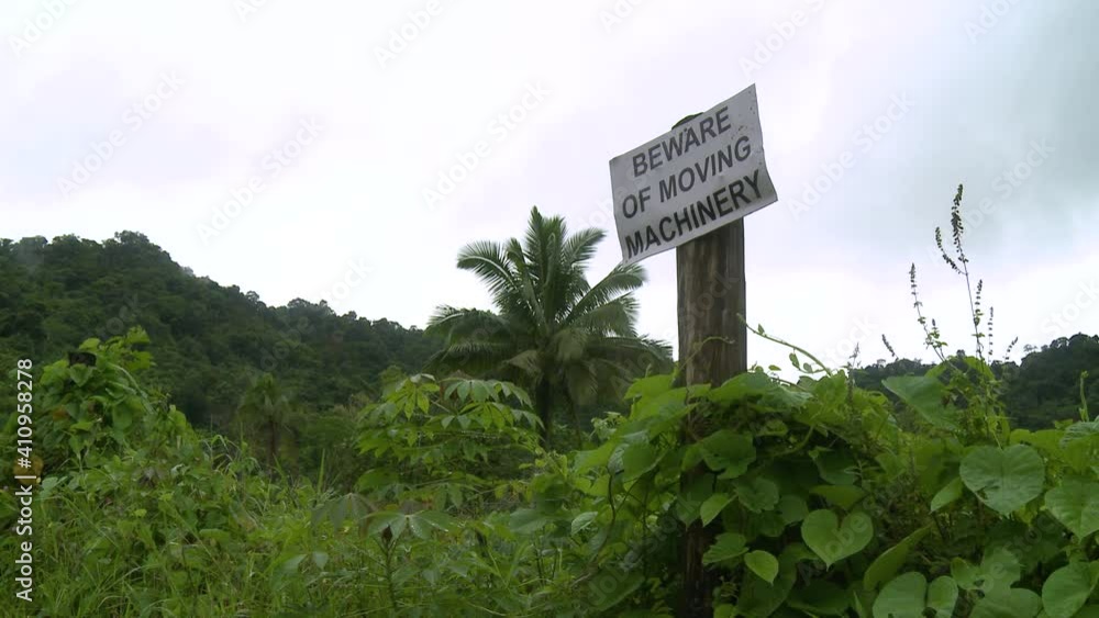 Locked down video with a focus on a warning sign, cautioning against ...