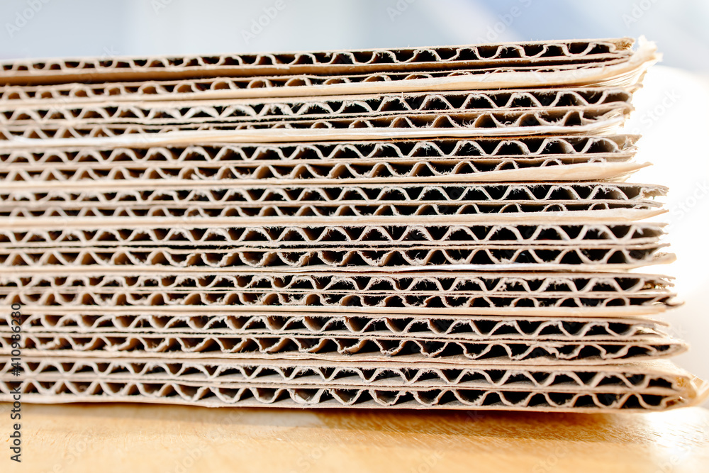 Bundle of brown paperboard packaging stack, ready for shipping ...