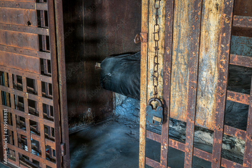 empty vintage jail cell with rusty bars and lock Stock Photo | Adobe Stock