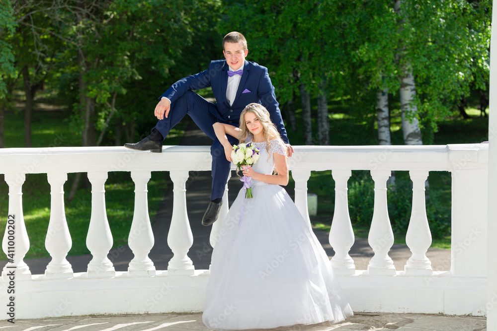 Sunny summer wedding day. Russian newlyweds, blonde bride and groom ...
