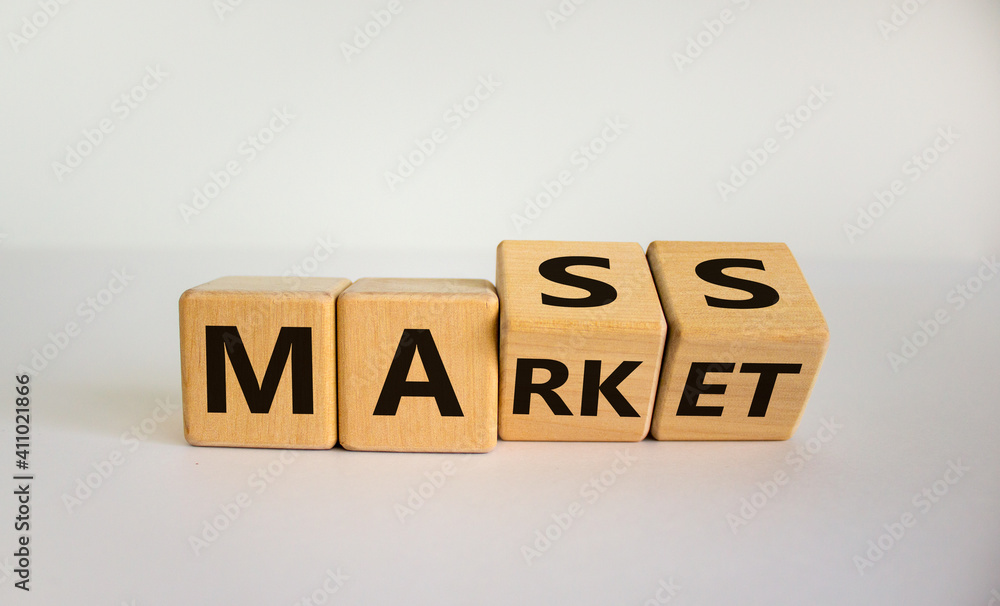 Mass market symbol. Turned wooden cubes with words 'mass market ...
