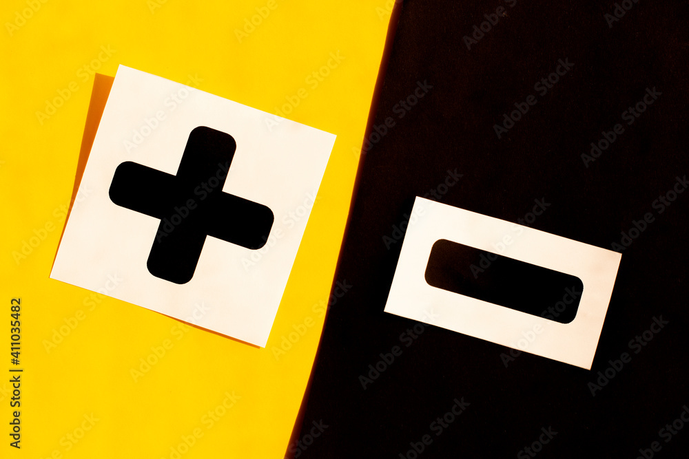 Symbols of black color plus and minus on black and yellow background ...