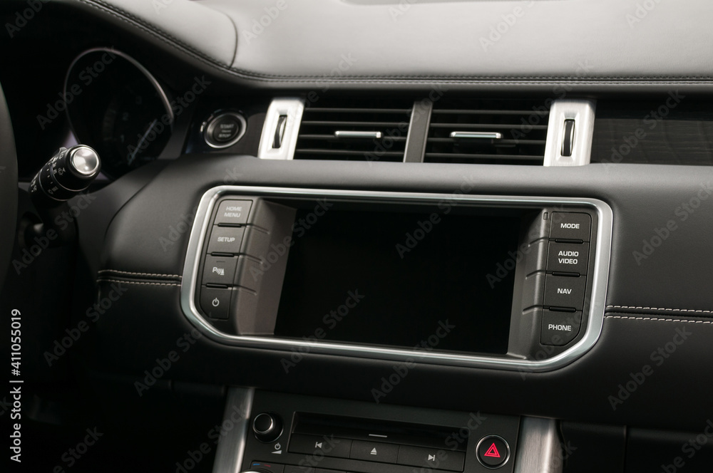Modern car dashboard with control buttons and touch screen multimedia ...