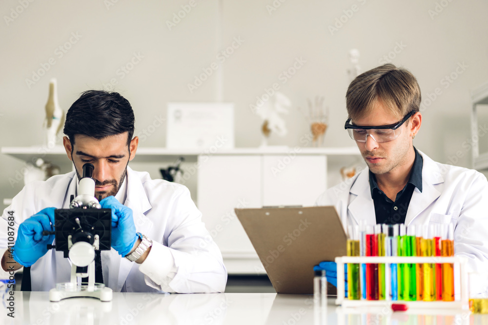 Professional two scientist man research and working doing a chemical ...