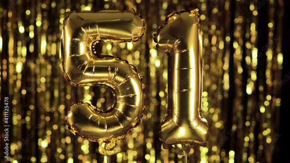 The golden number 51 fifty one is made from an inflatable balloon on a ...