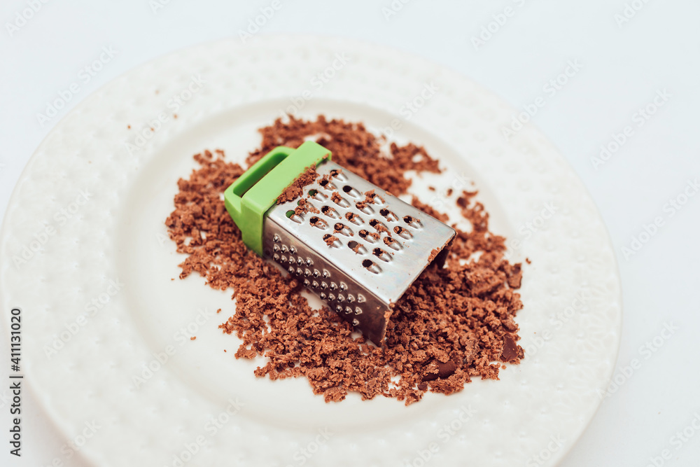 Grate Chocolate Bar Using Handheld Grater. Making Boston Banoffee Pie ...