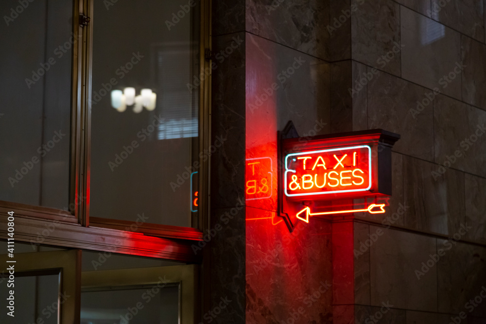 Old Vintage, Train Station, Red Glowing Neon Sign "Taxi & Buses" with a ...
