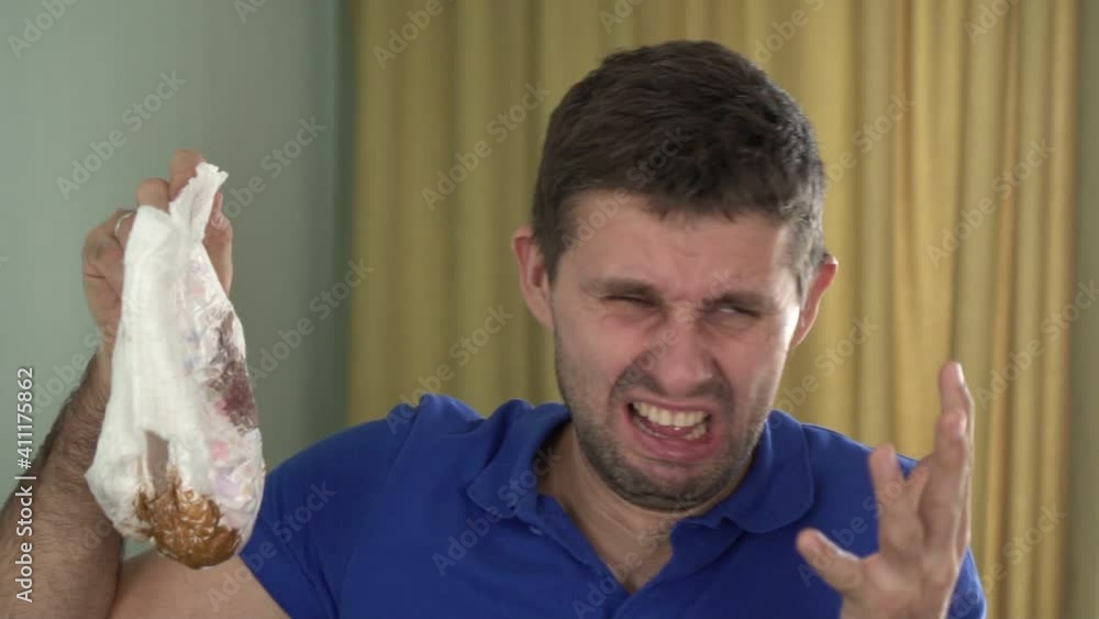 Sad man father with dirty smelly baby diaper, slow motion Stock ビデオ ...