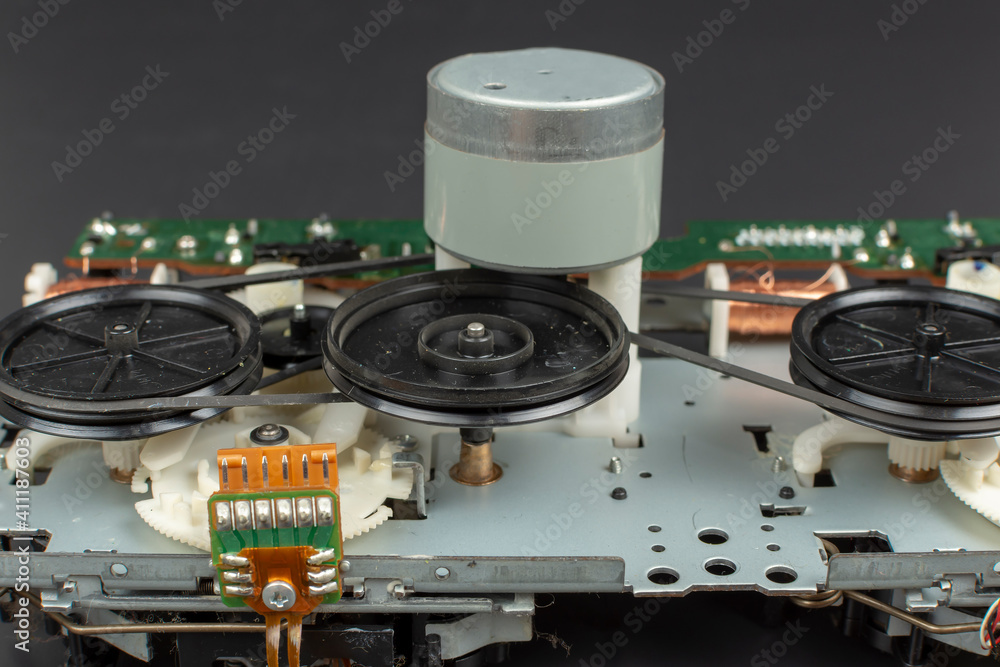 Mechanism for a tape recorder with gears in an exploded view close-up ...
