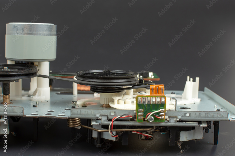 Mechanism for a tape recorder with gears in an exploded view close-up ...