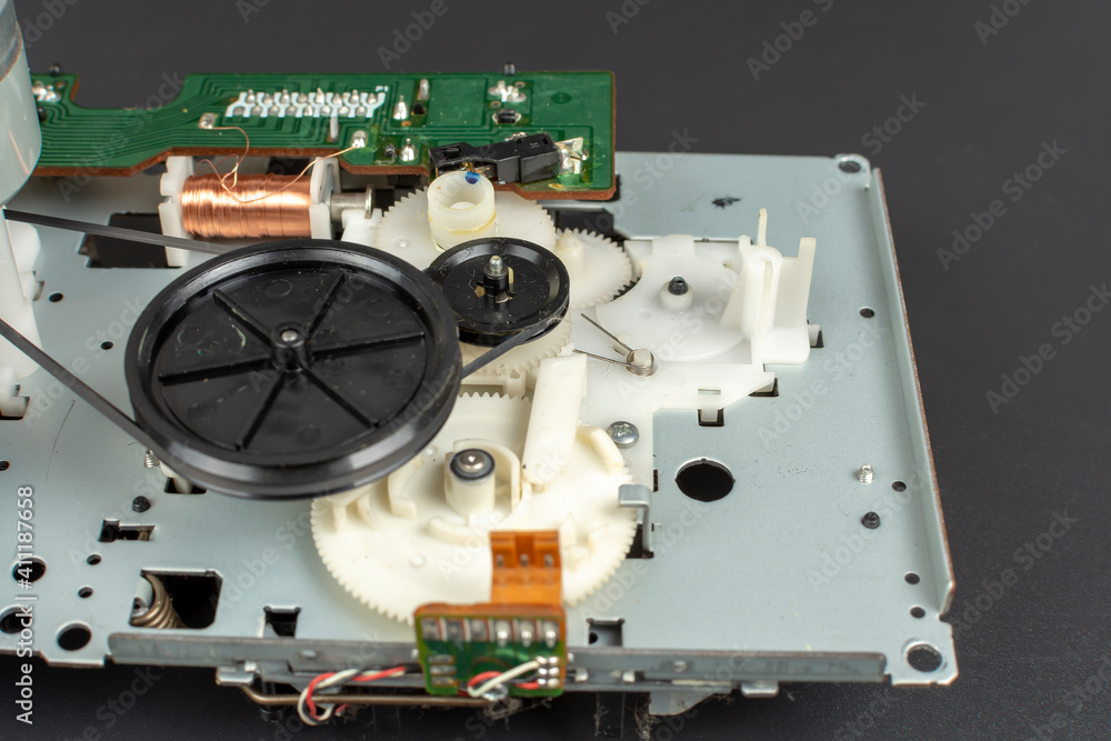 Mechanism for a tape recorder with gears in an exploded view close-up ...