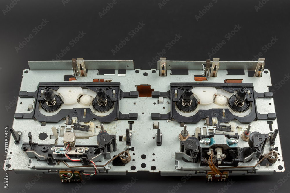 Mechanism for a tape recorder with gears in an exploded view close-up ...