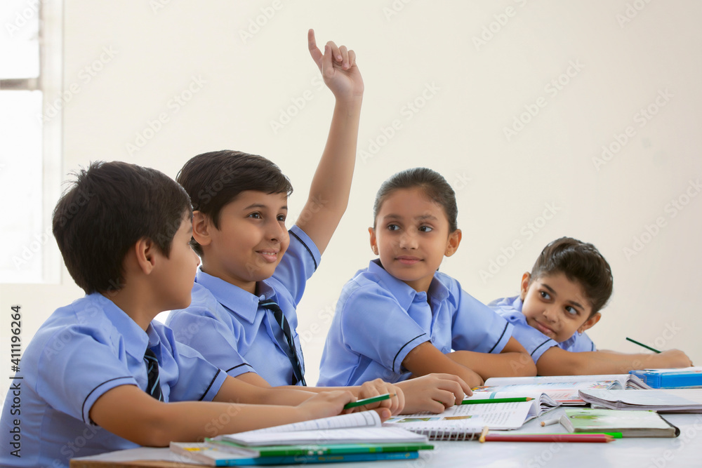 school boy asking for a doubt in class Stock Photo | Adobe Stock