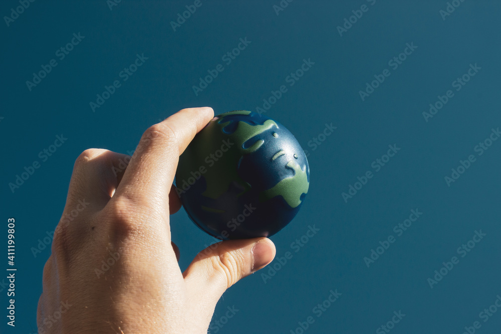 Earth Day. Male hand holding earth in his hands. Human saving planet ...