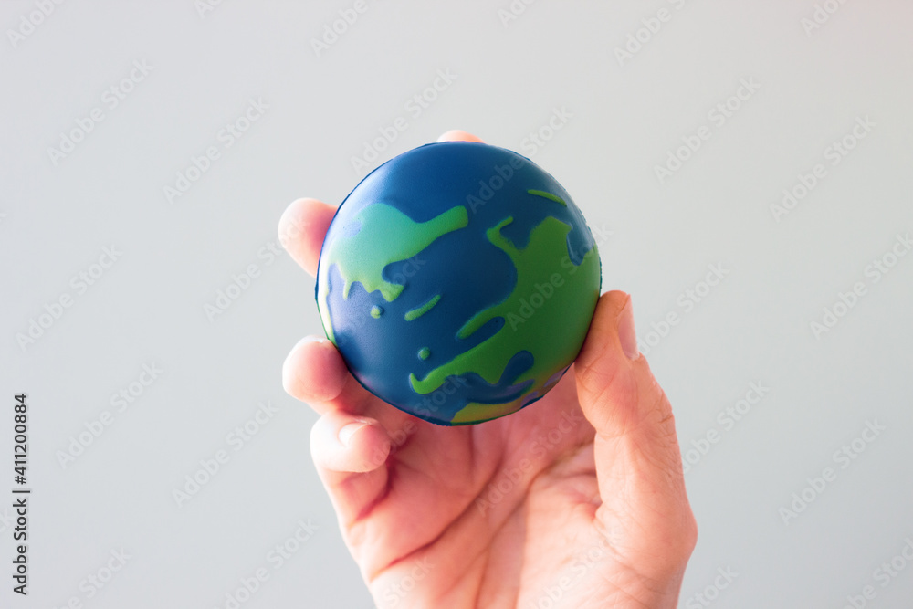 Earth Day. Male hand holding earth in his hands. Human saving planet ...