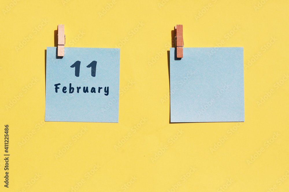 11st of February. 11st day of the month, calendar date. Two blue sheets ...