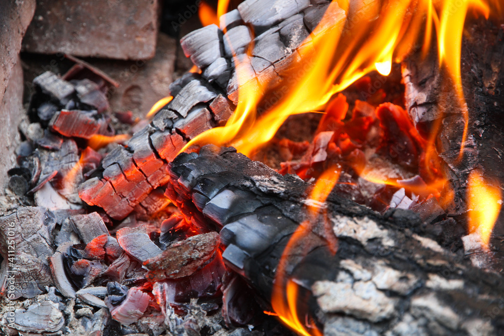 Glowing embers in hot red color, abstract background. The hot embers of ...