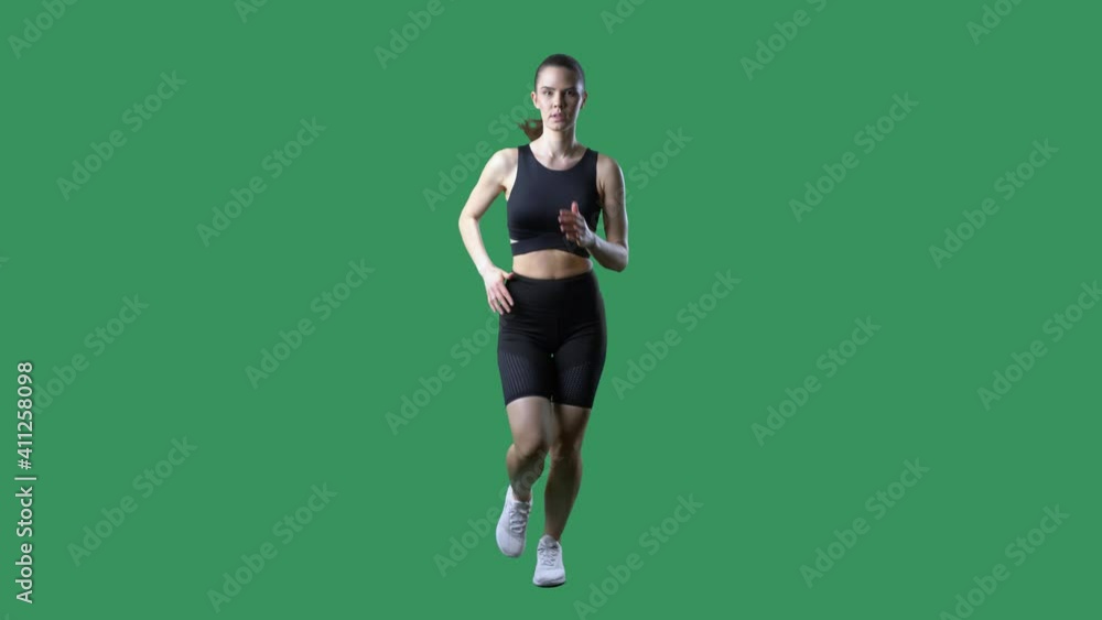 Slow motion of young sporty woman running on treadmill. Full body on ...