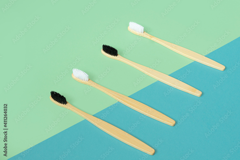 family set of four wooden bamboo toothbrushes for the whole family on a ...