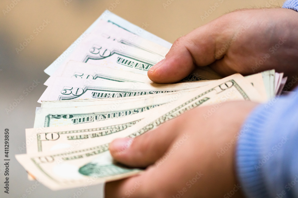 Man hands counting money, counting US dollars currency, close up Stock ...