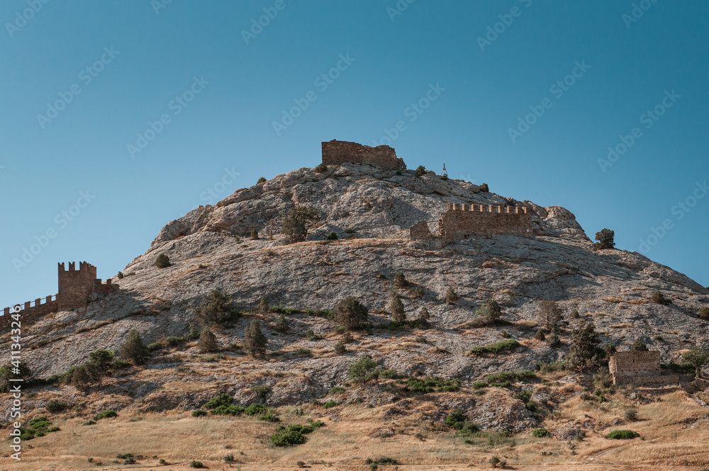 Top of fortress mountain peak with ancient ruins of towers medieval ...