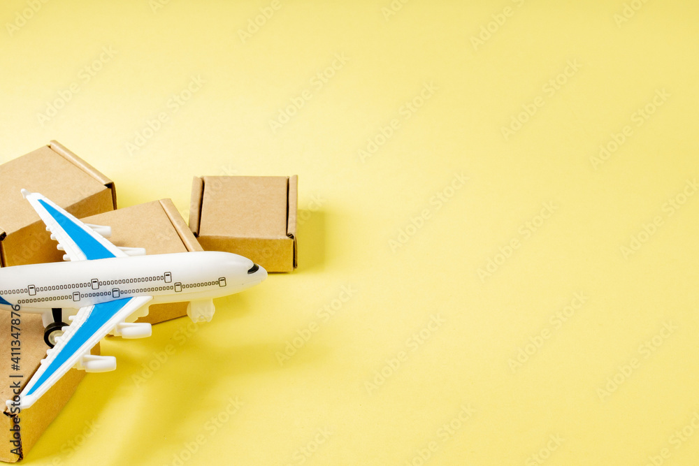 Airplane and stack of cardboard boxes. concept of air cargo and parcels ...